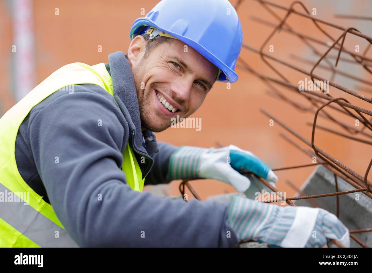 worker fixing steel rebar at building site Stock Photo - Alamy