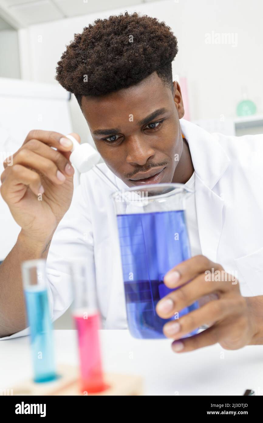 a scientist doing experiments with chemical liquid in the lab Stock ...