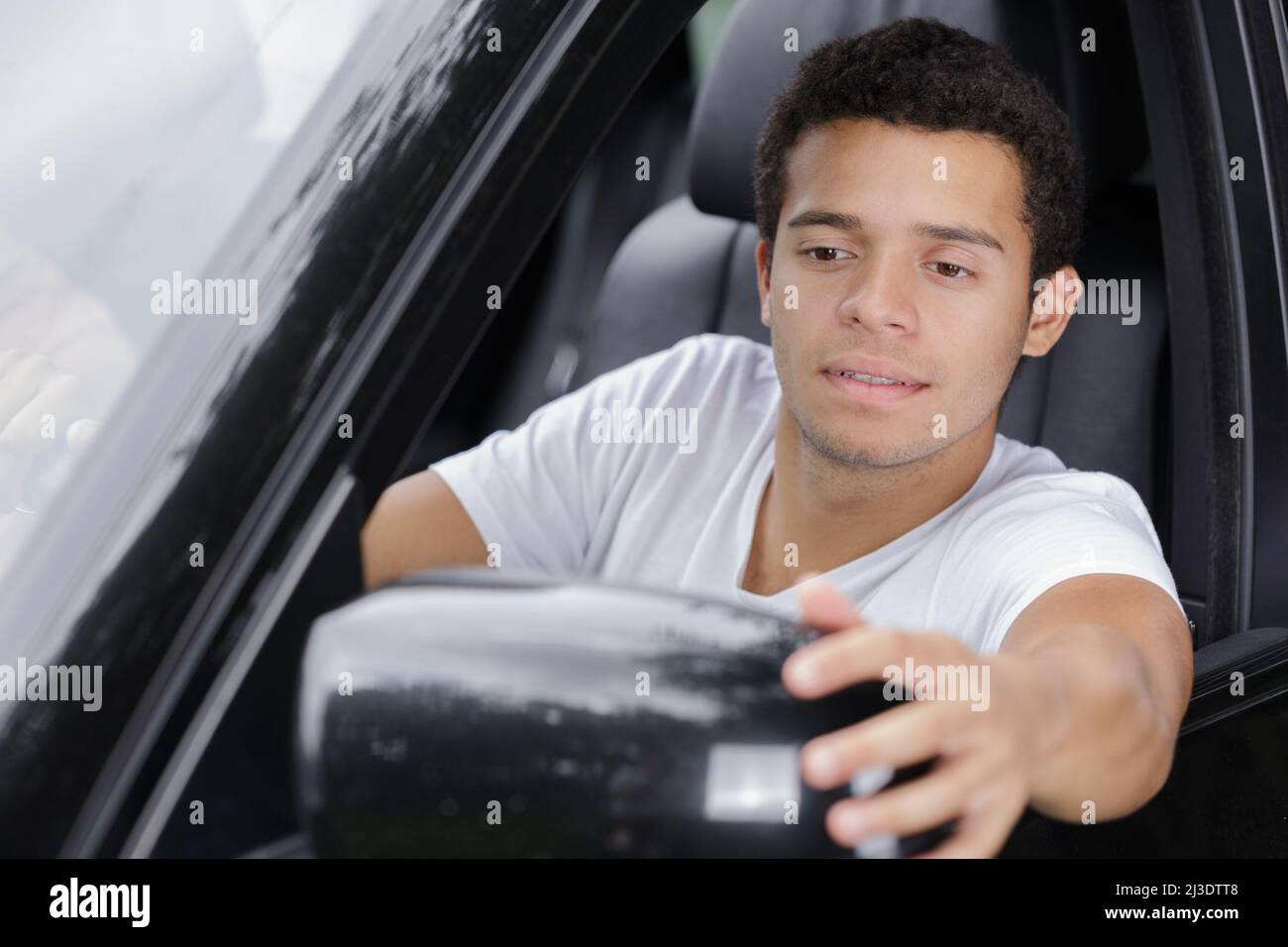 Checking rear view mirror hi-res stock photography and images - Alamy