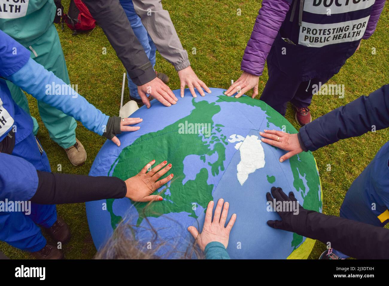 London, England, UK. 7th Apr, 2022. Protesters place their hands on a ...