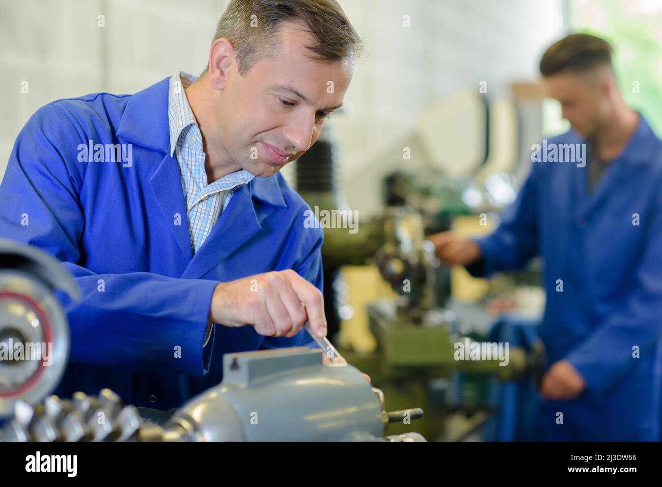 an engineer working on machine Stock Photo - Alamy