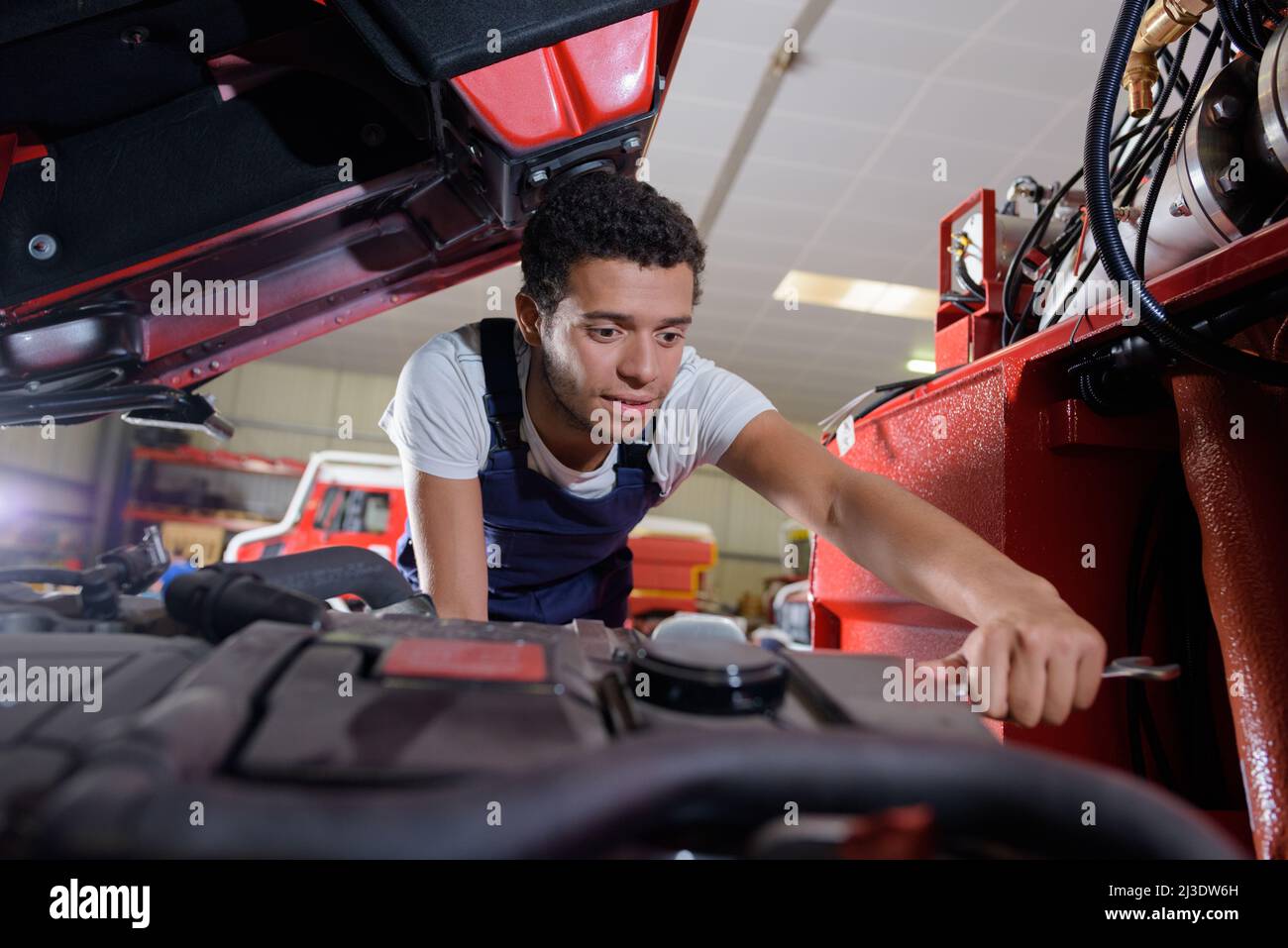 Men working on a car engine hi-res stock photography and images - Alamy