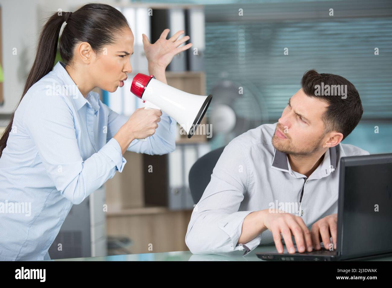 middle age woman yelling through megaphone Stock Photo - Alamy