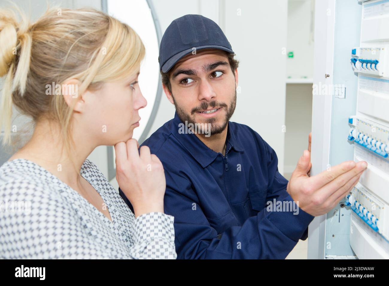professional plumber and female worker Stock Photo - Alamy