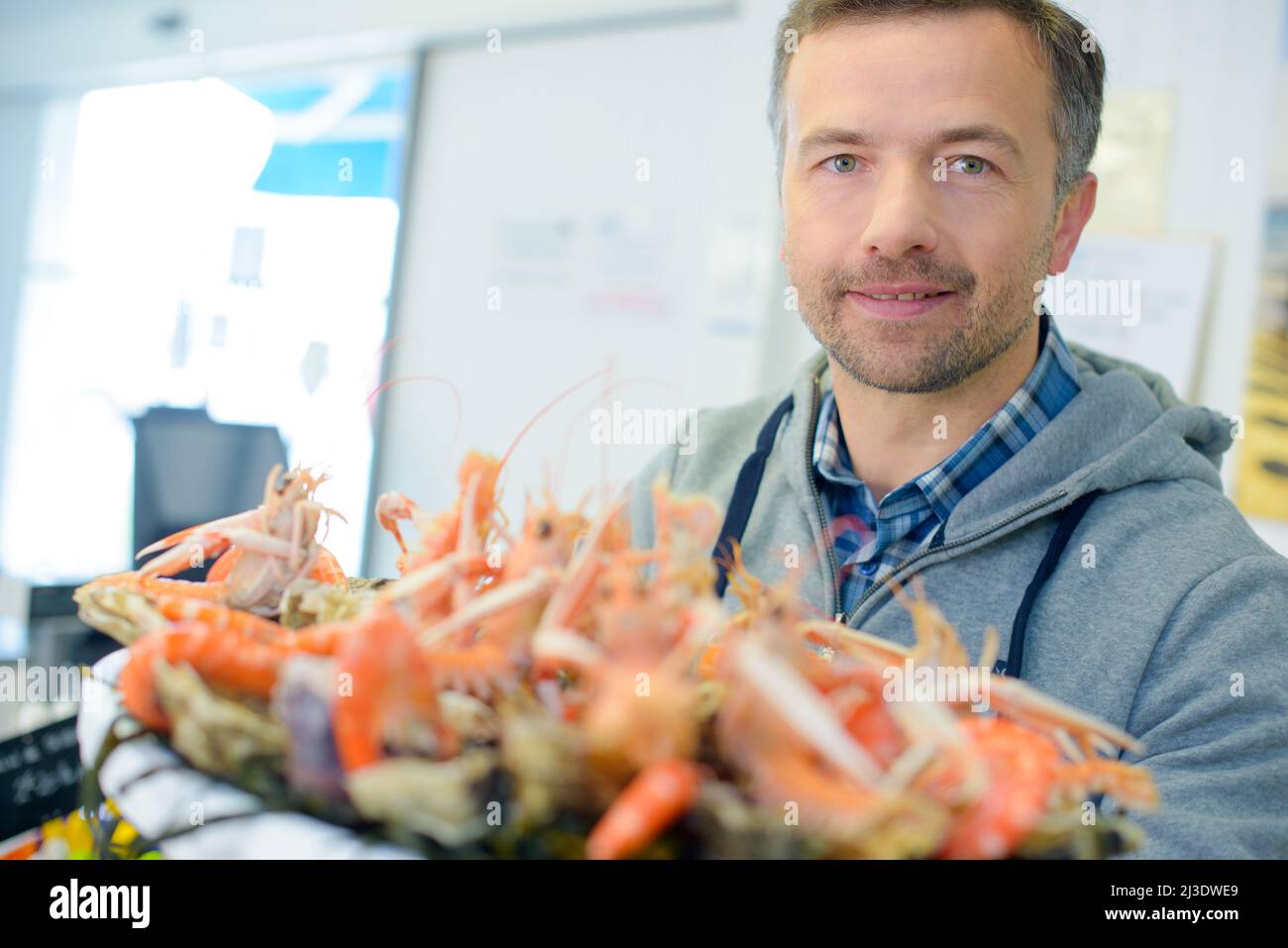 Man holding fish by its tail hi-res stock photography and images - Alamy