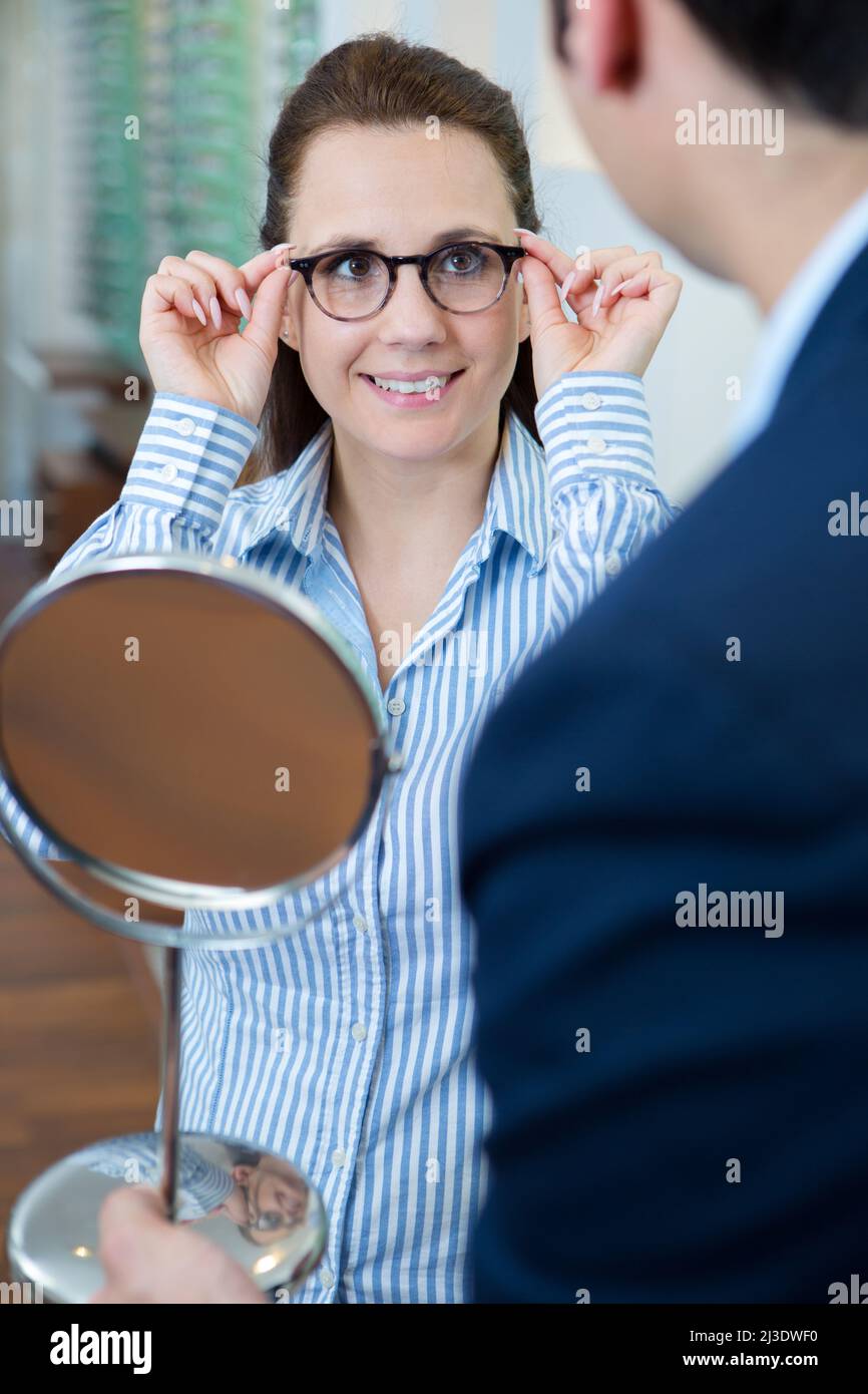 woman asking if the eyeglasses looks nice on her Stock Photo - Alamy