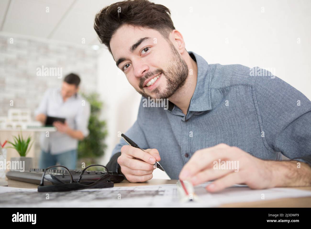 young architect with ruler and pencil Stock Photo - Alamy