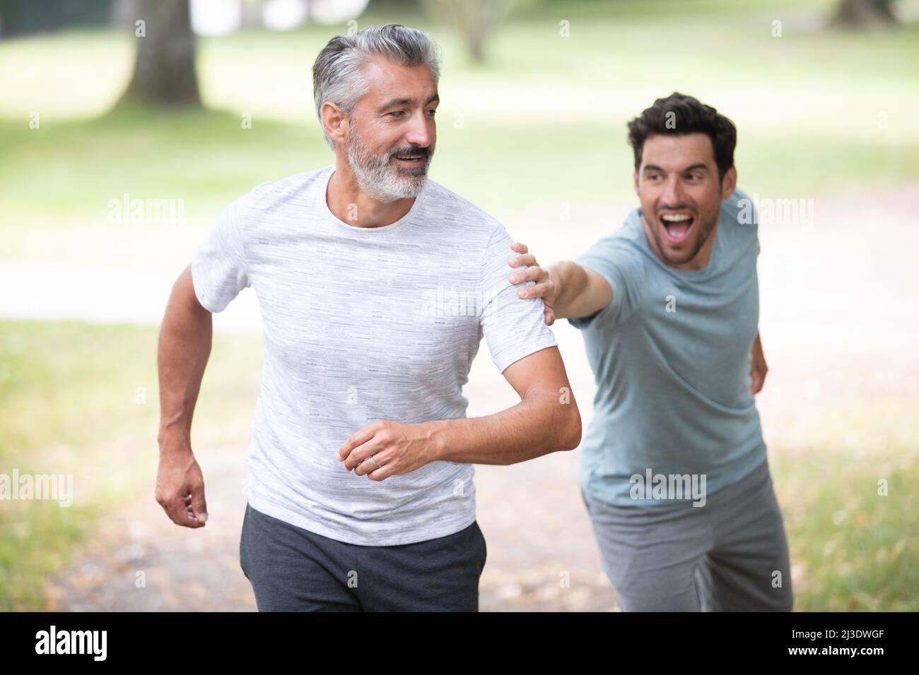 two men are running together Stock Photo - Alamy