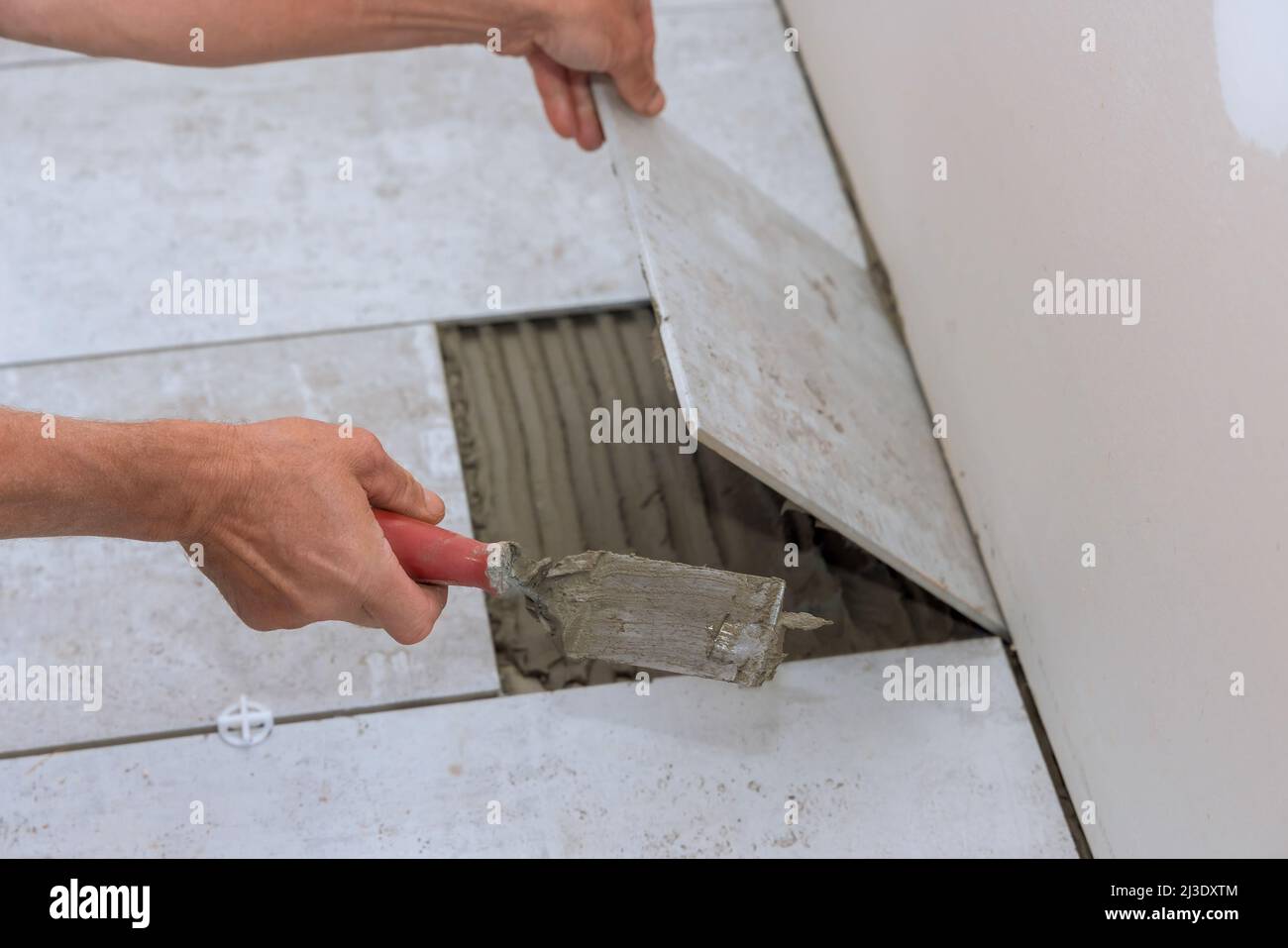 Ceramic tiles installation Home improvement, renovation Stock Photo - Alamy