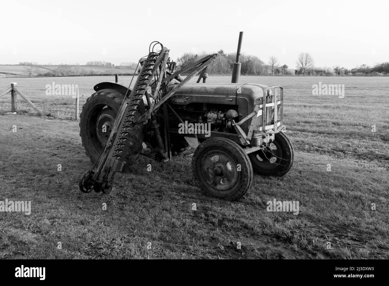 An old antique hedge trimmer mounted on a vintage tractor Stock Photo ...