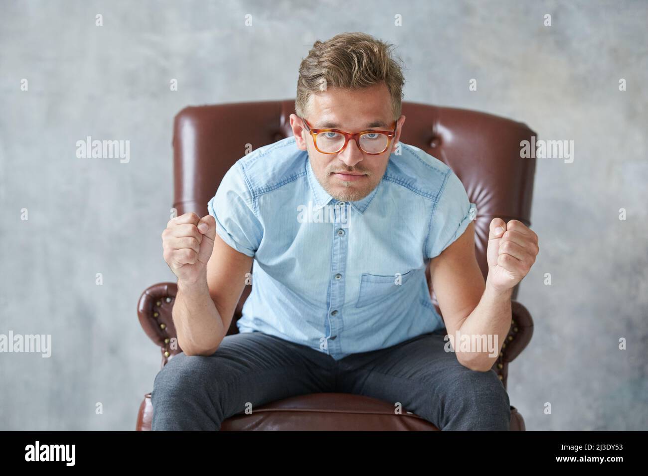 Portrait of a stylish intelligent man stares into the camera, small ...