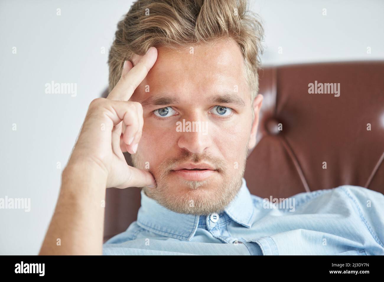 Portrait of a stylish intelligent man, small unshaven, charismatic ...