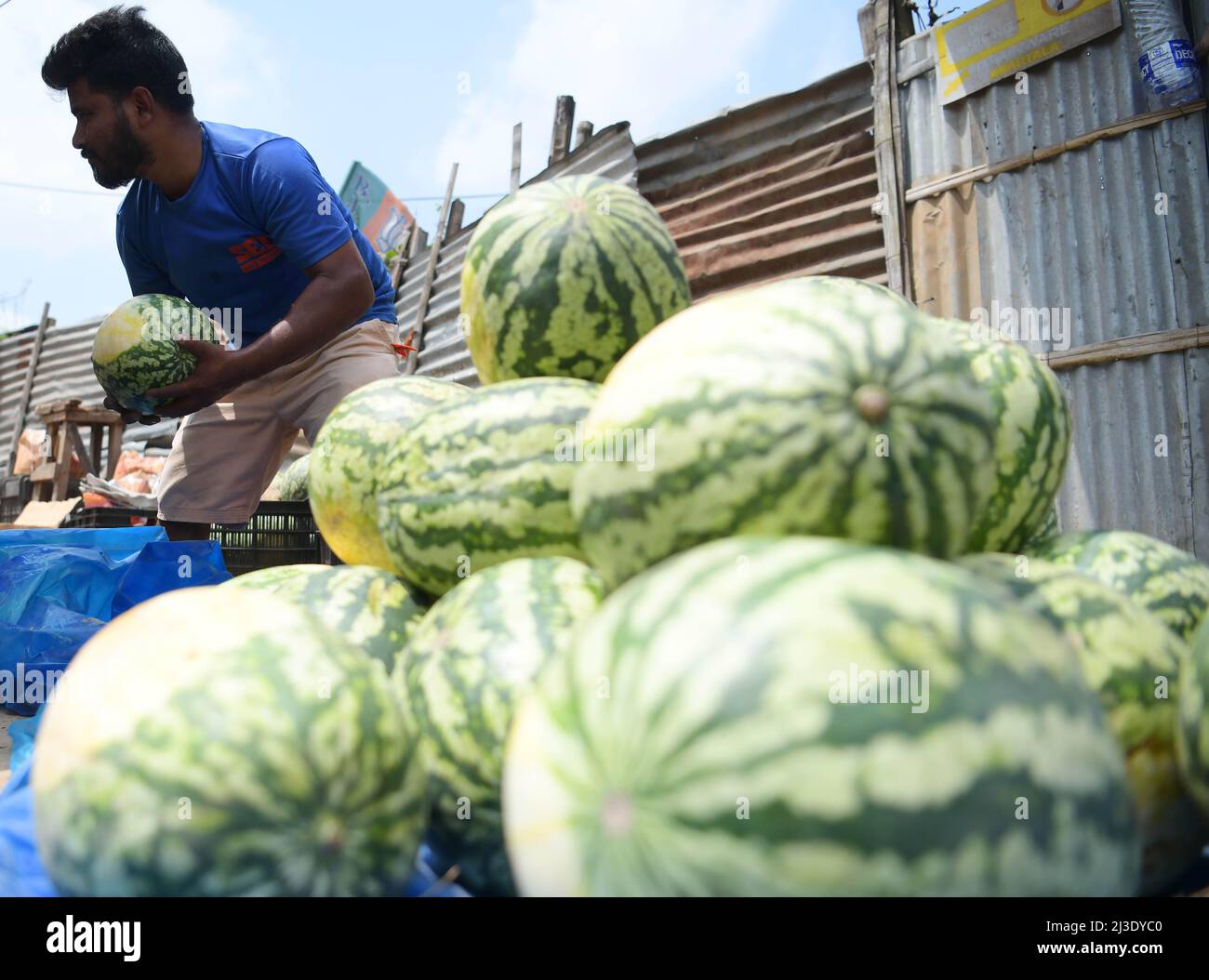 Vendors sell watermelons at a roadside fruit shop in Agartala. Tripura ...
