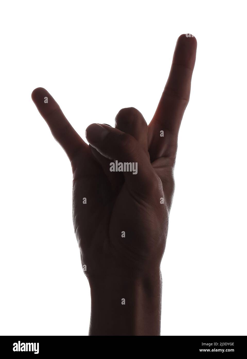 Silhouette of male hand showing "devil horns" gesture on white ...