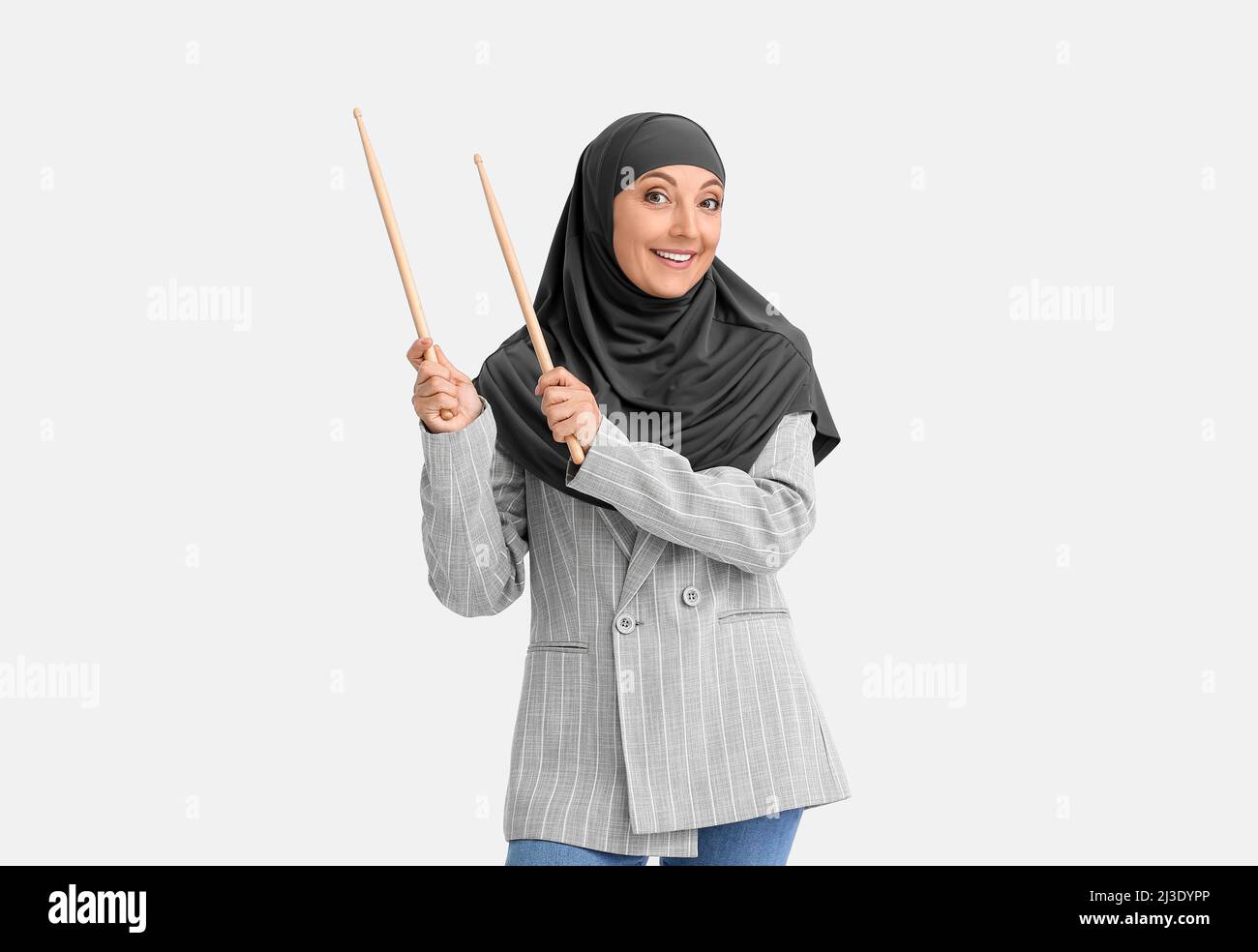 Muslim music teacher on light background Stock Photo - Alamy