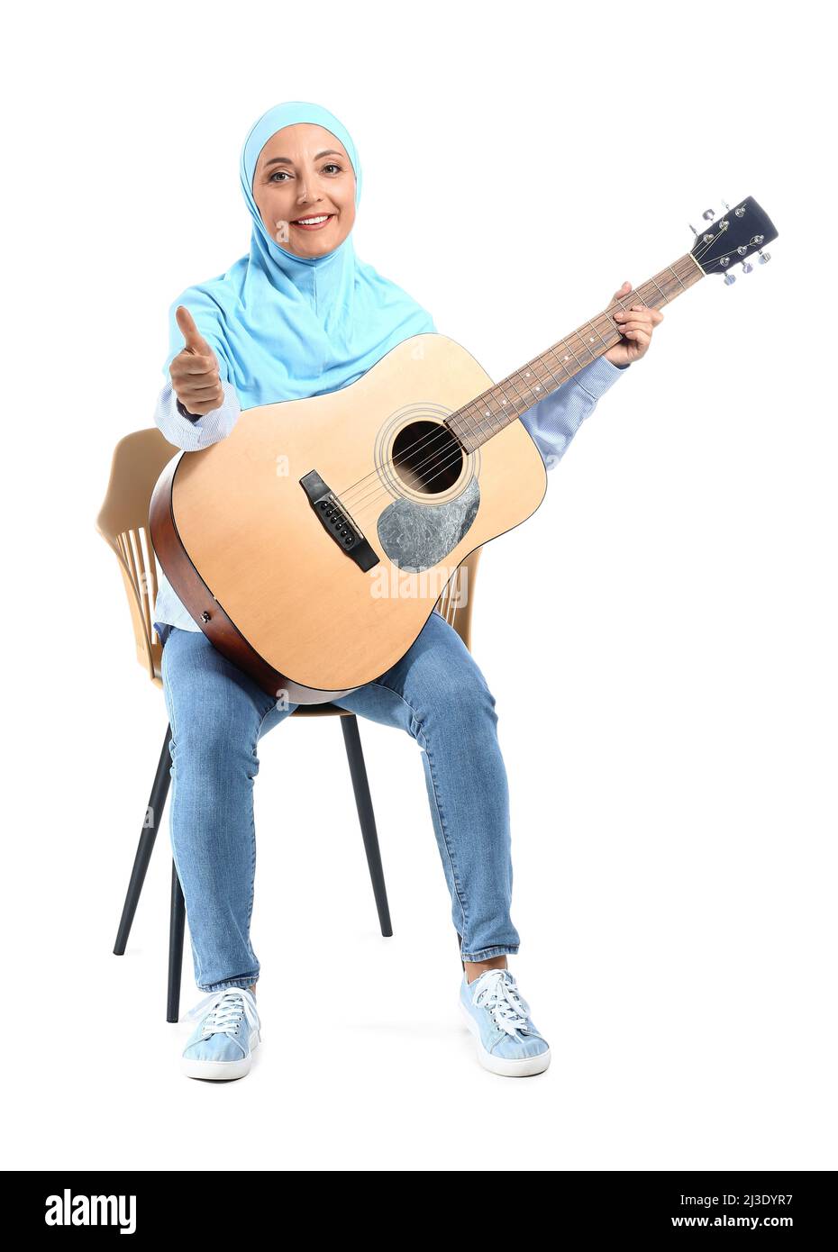 Muslim music teacher with guitar on white background Stock Photo - Alamy