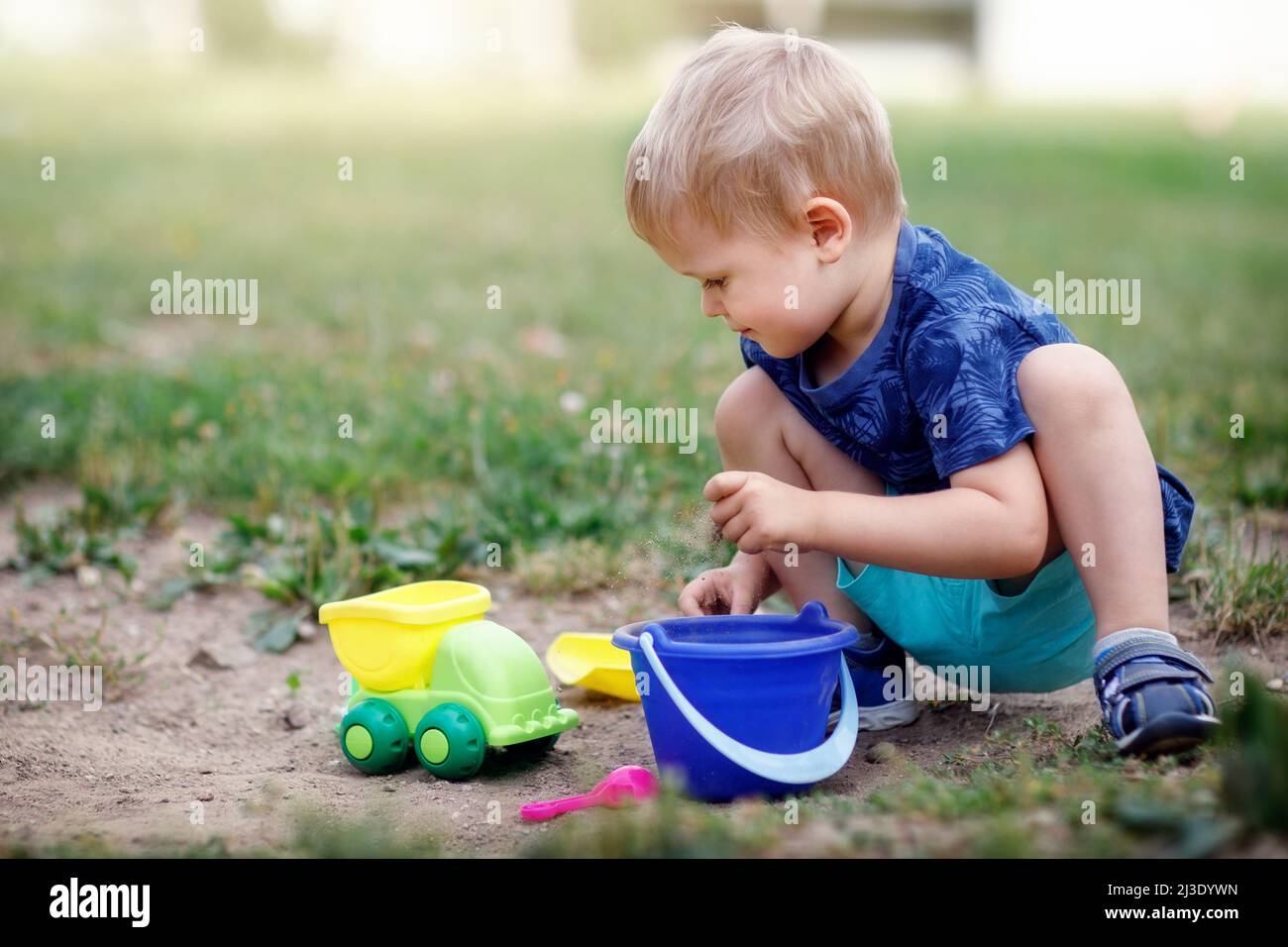 Boy bucket sand hi-res stock photography and images - Alamy