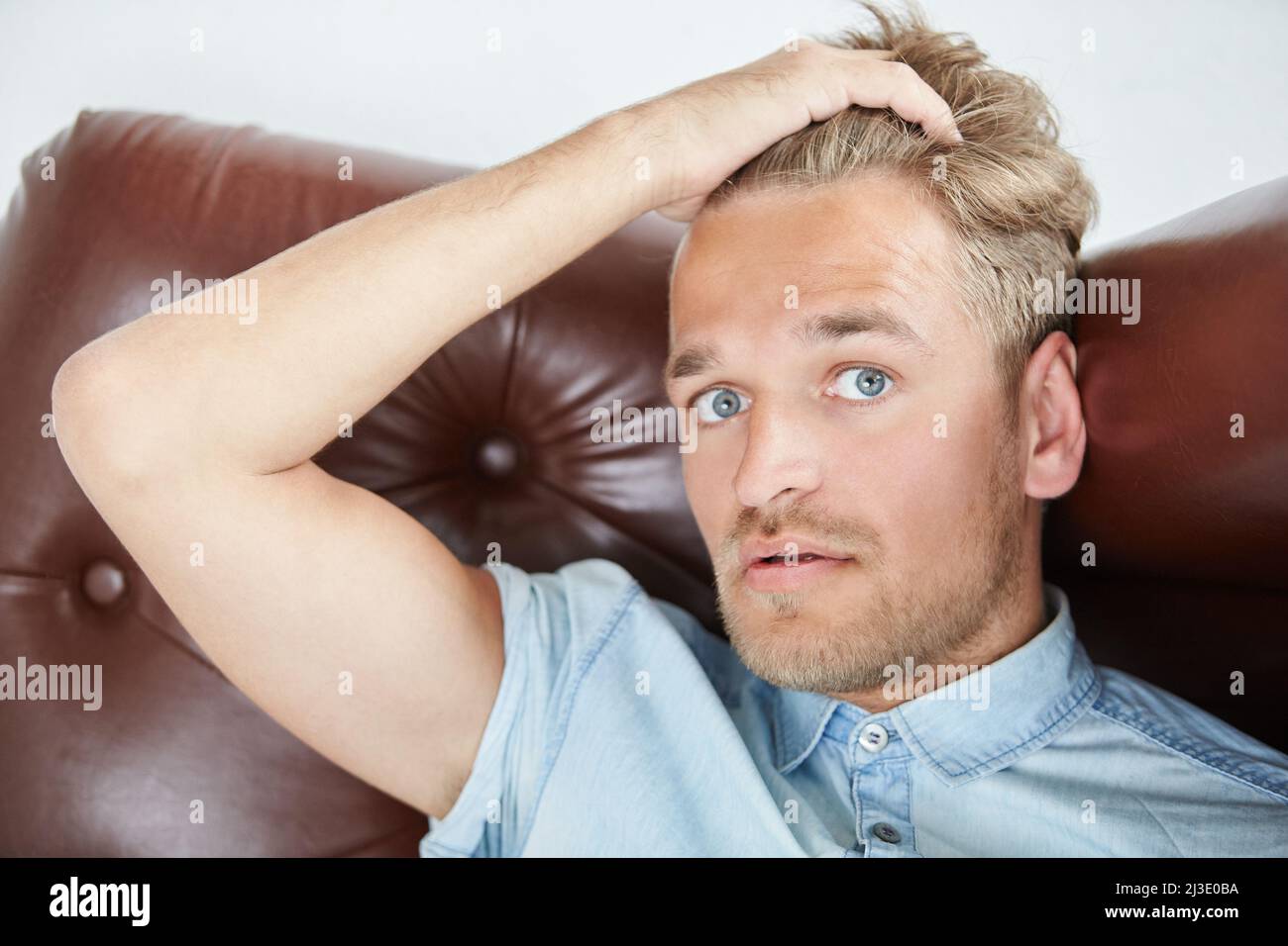 Hand behind his head hi-res stock photography and images - Alamy