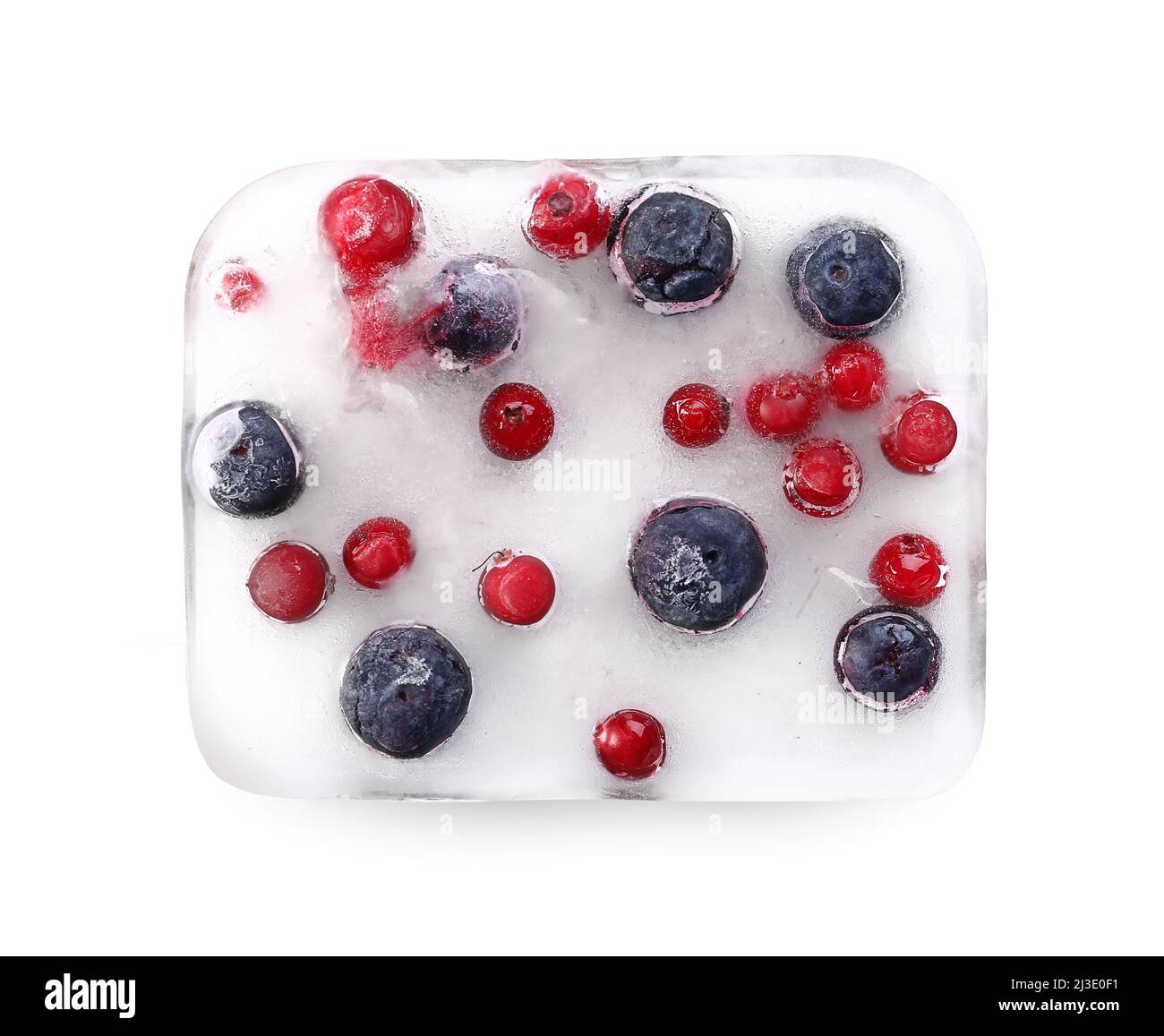 Fresh berries frozen in ice on white background Stock Photo - Alamy