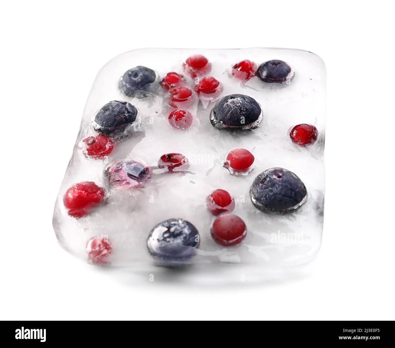 Fresh berries frozen in ice on white background Stock Photo - Alamy