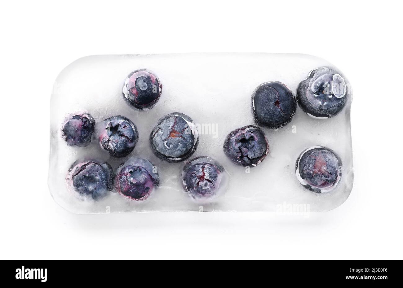 Fresh blueberry frozen in ice on white background Stock Photo - Alamy