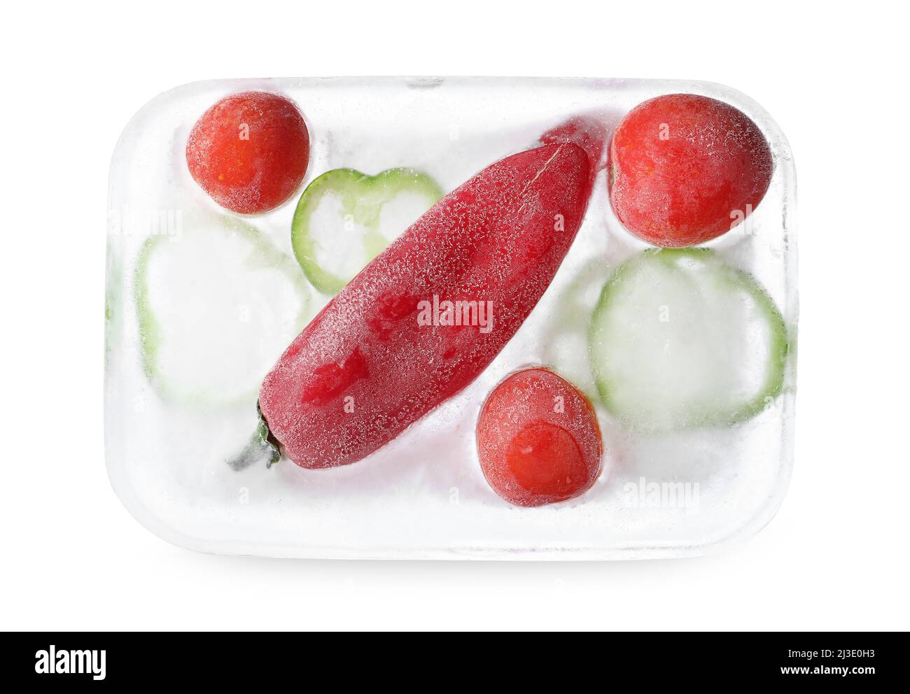 Fresh vegetables frozen in ice on white background Stock Photo - Alamy
