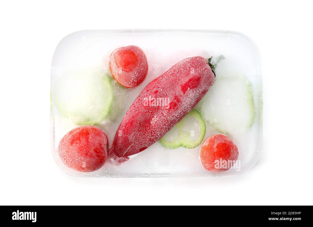 Fresh vegetables frozen in ice on white background Stock Photo - Alamy
