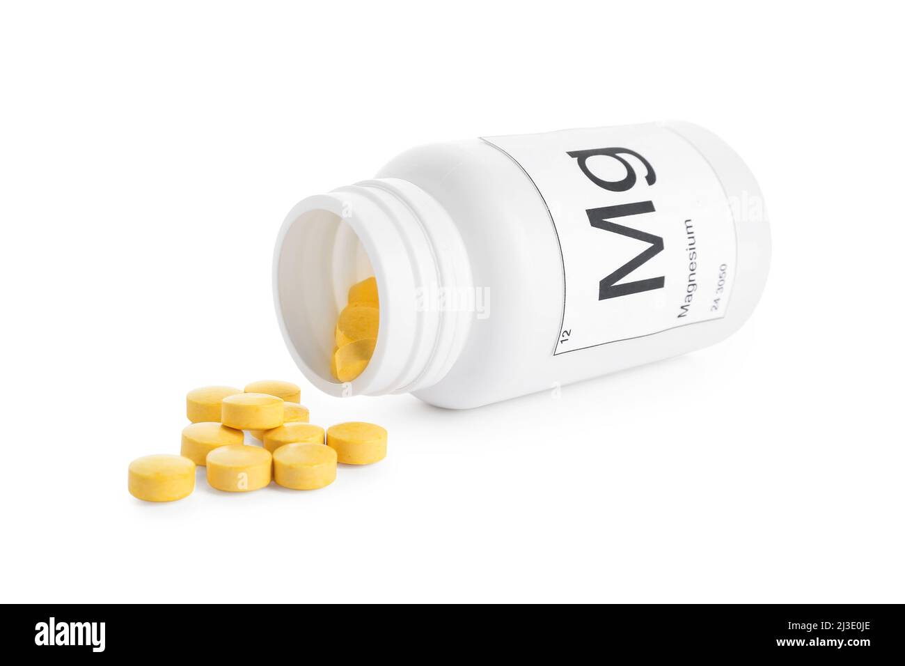 Overturned bottle of magnesium pills on white background Stock Photo ...