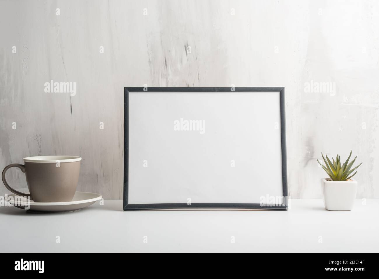 Empty white frame with flower on wall background. The concept of design ...