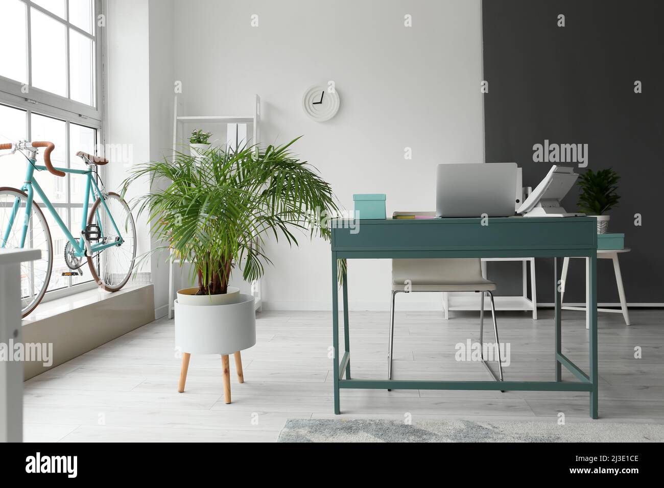 Workplace with modern laptop and landline phone in stylish office ...