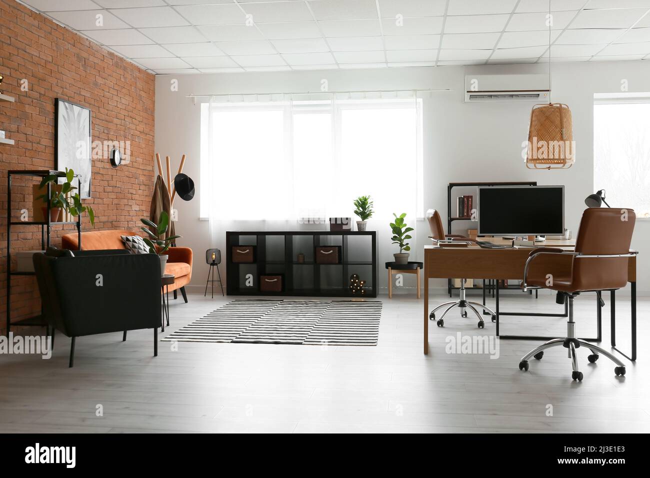 Workplace with modern computer in light office interior Stock Photo - Alamy