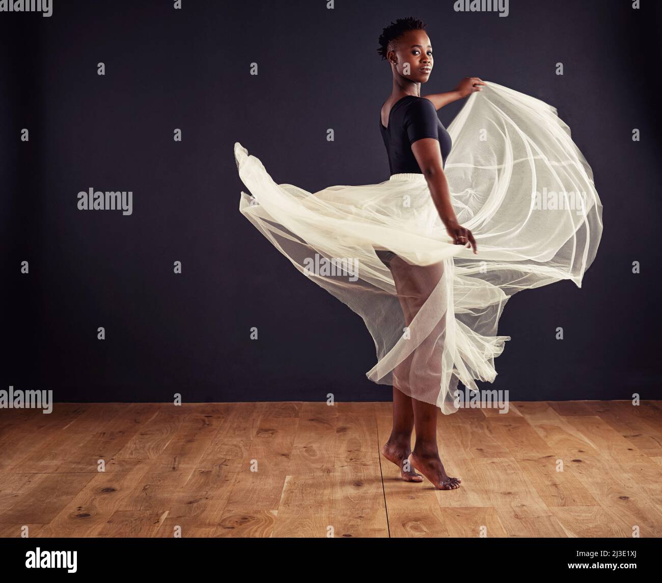 Freedom of movement. Young female contemporary dancer using a soft ...