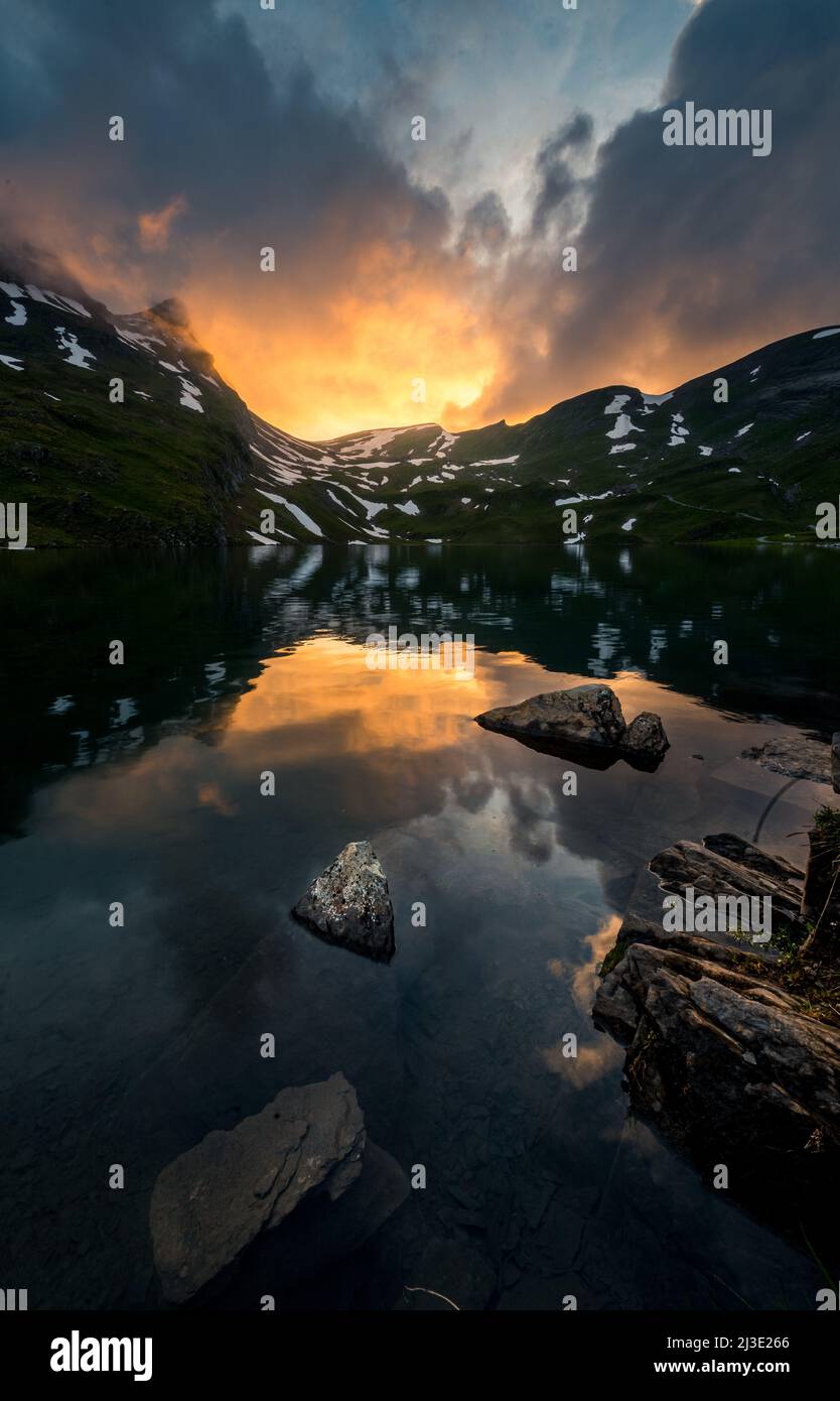 spectacular sunset at an alpine lake near Grindelwald in the Swiss Alps ...