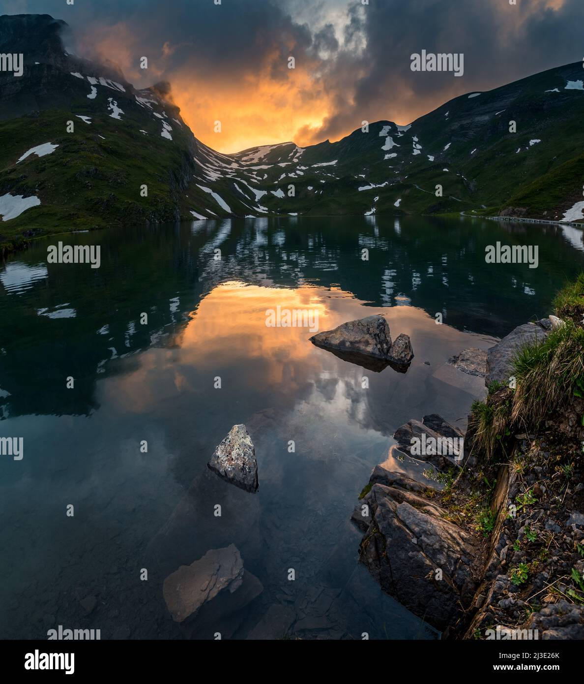 spectacular sunset at an alpine lake near Grindelwald in the Swiss Alps ...