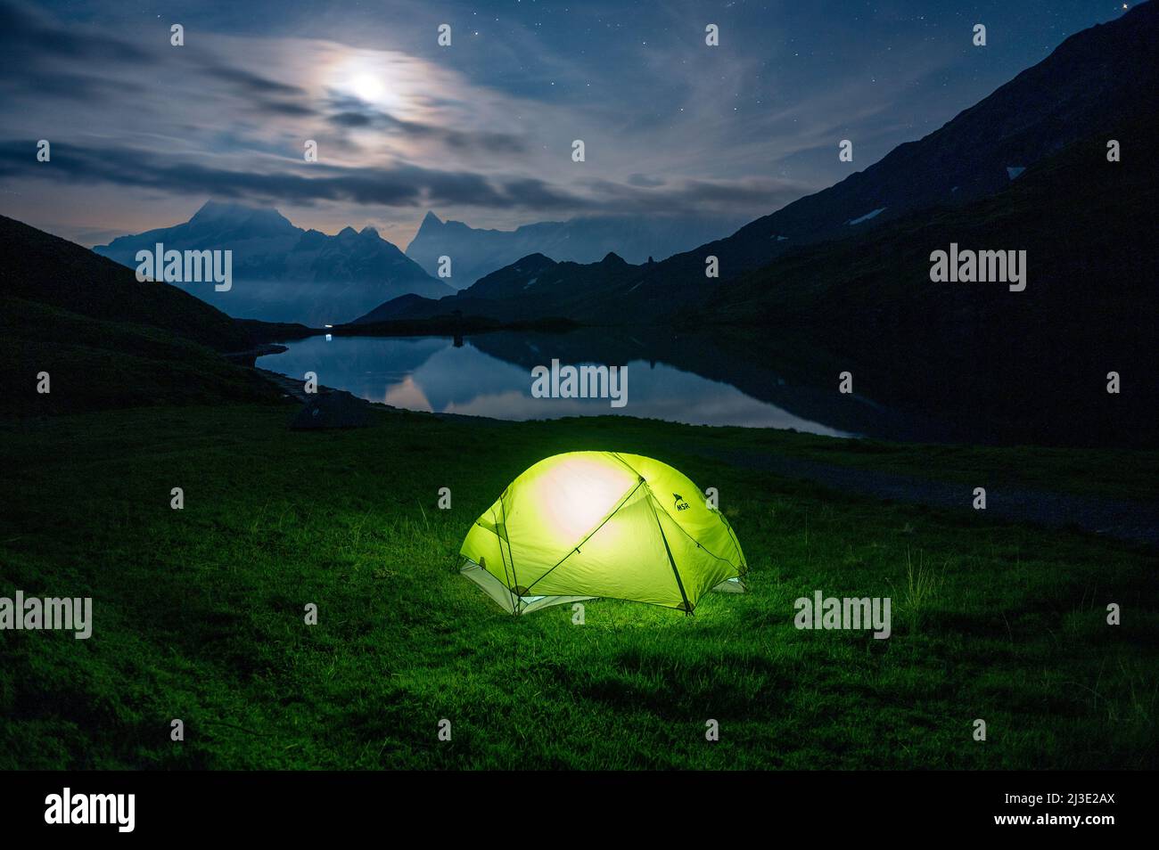 wild camping under full moon light in the swiss alps Stock Photo - Alamy