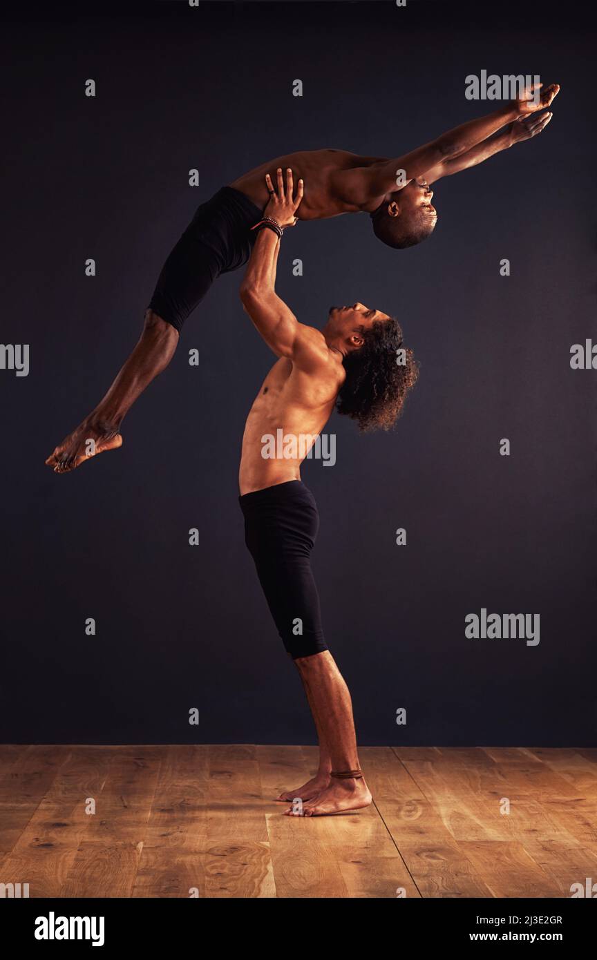 Together we can fly. Two male contemporary dancers performing a ...
