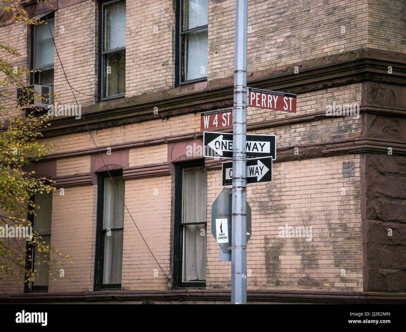 Street signs at the corner of West 4th street and Perry St in the West ...
