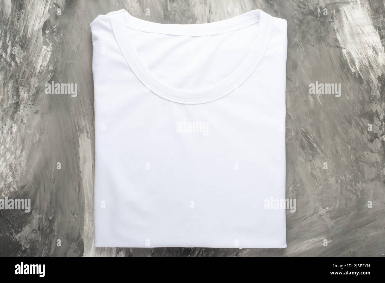 Top view of a white T-shirt on a dark background, mocap Stock Photo - Alamy
