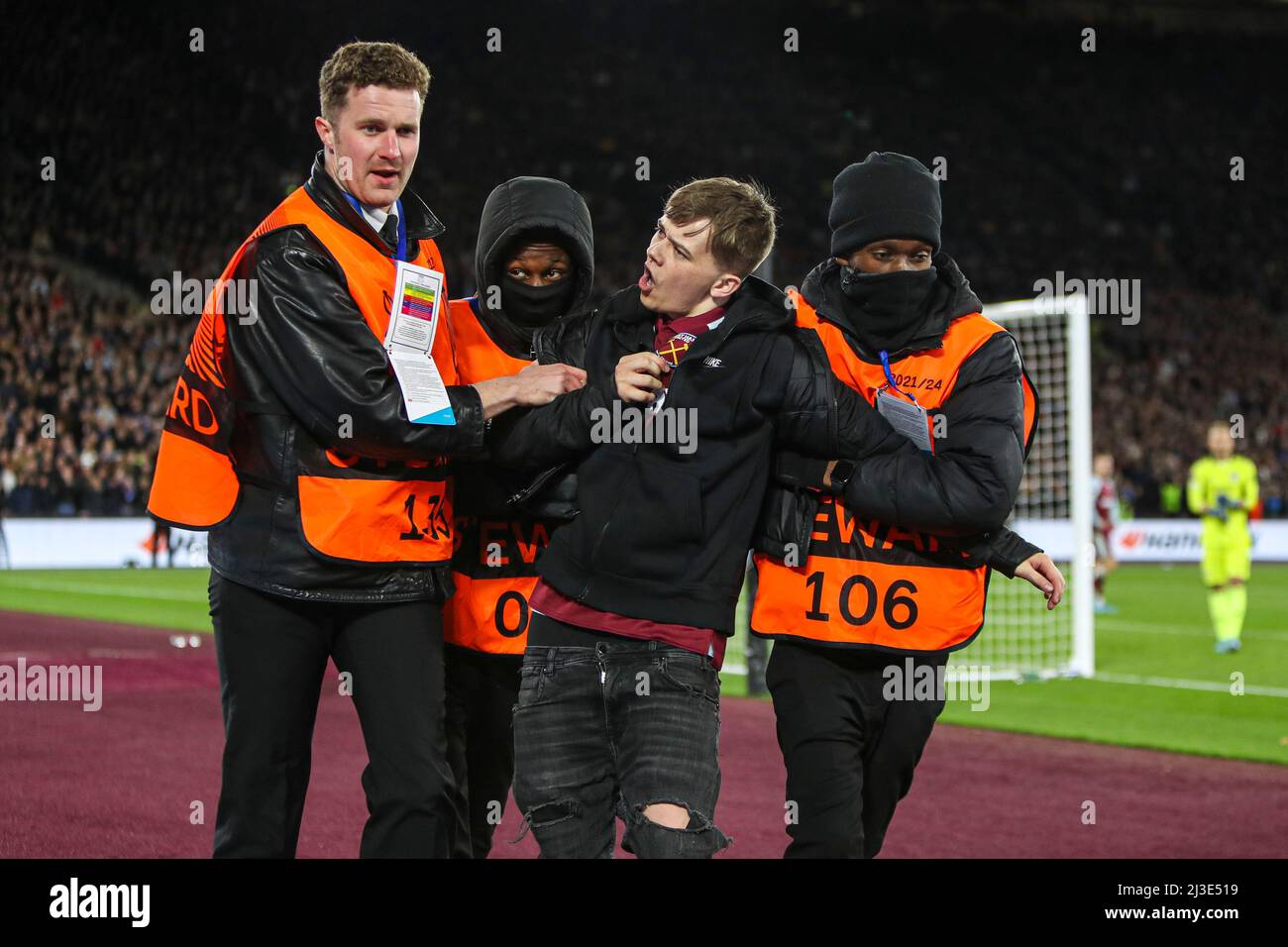 London, England, 7th April 2022. A pitch invader is removed from the ...