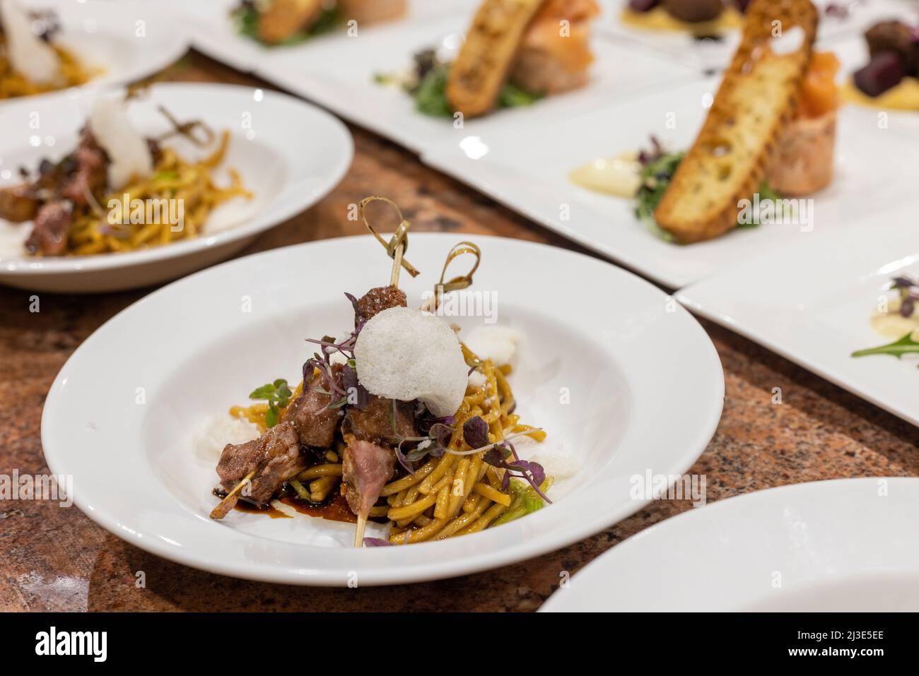 Plated up food waiting to be served from a commercial kitchen for an ...
