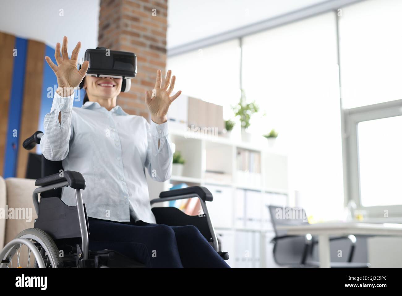 Playing computer game in wheelchair hi-res stock photography and images ...