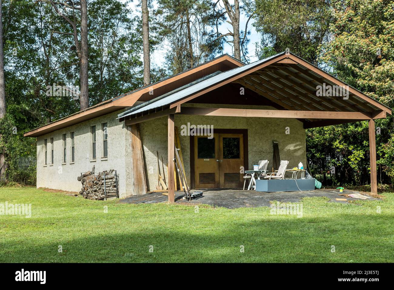 Outdoor storage building made of stucco on top of cinder block walls ...
