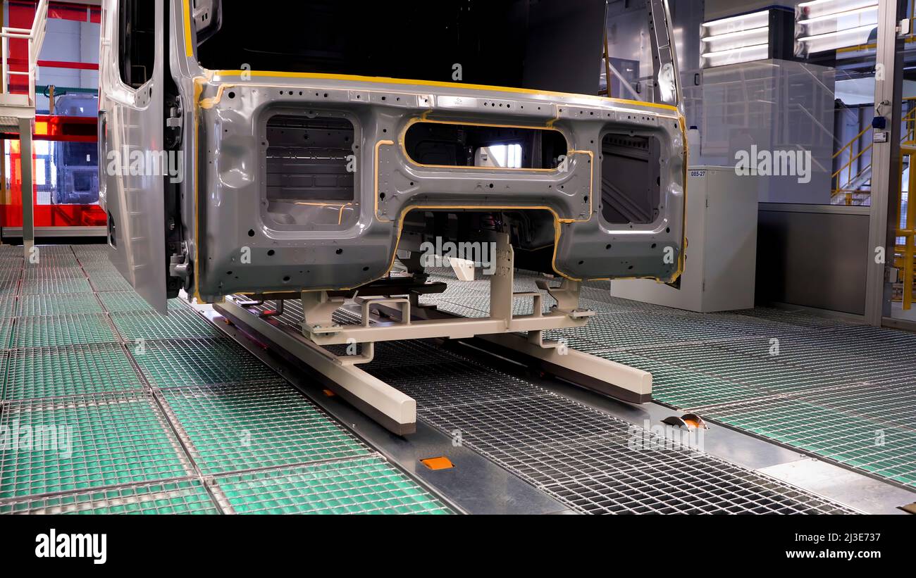 Process of truck car automated assembly, machine industry. Scene. Metal ...