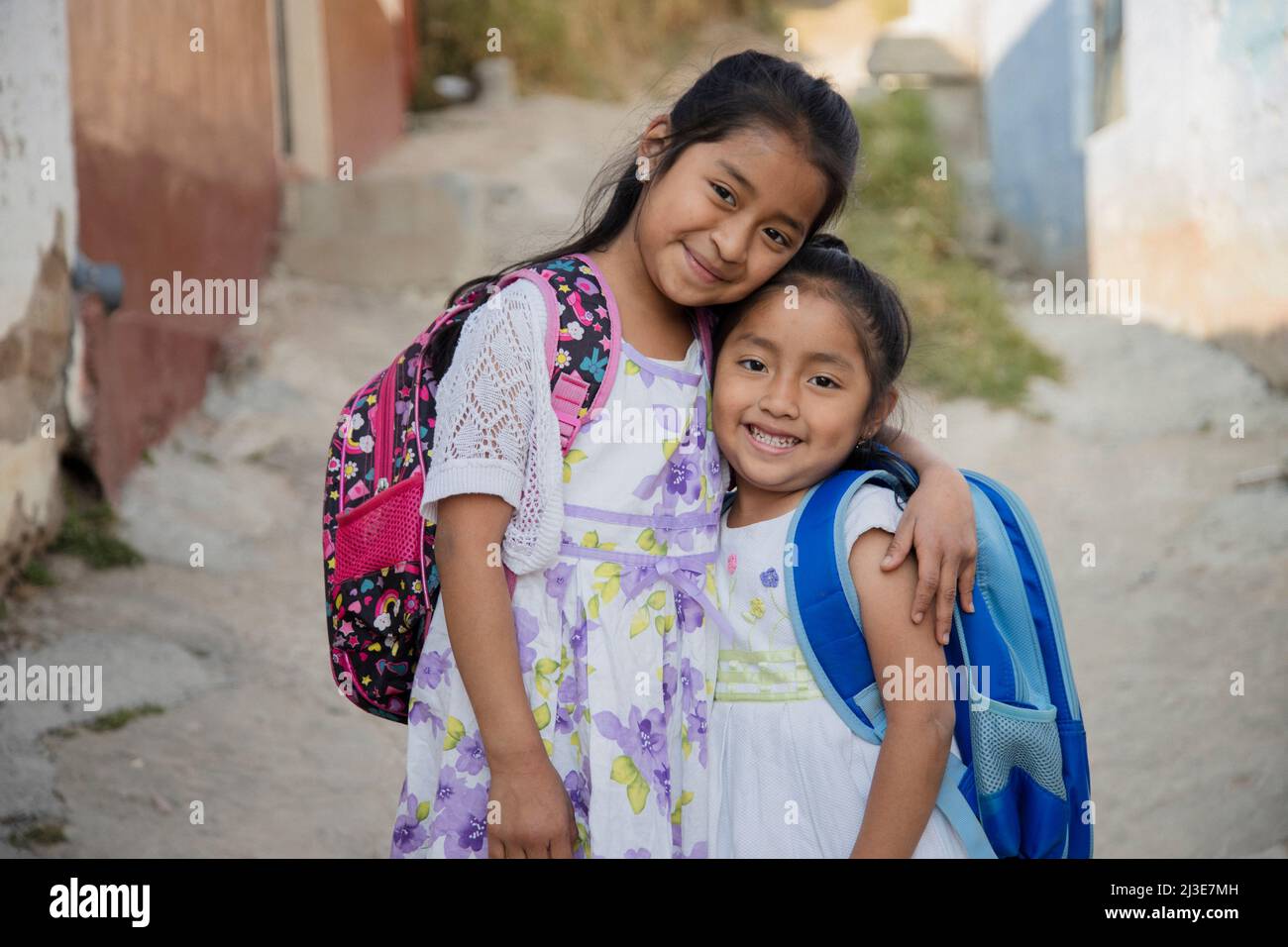 Hispanic girls ready to go to school in rural area - Latin sisters on ...