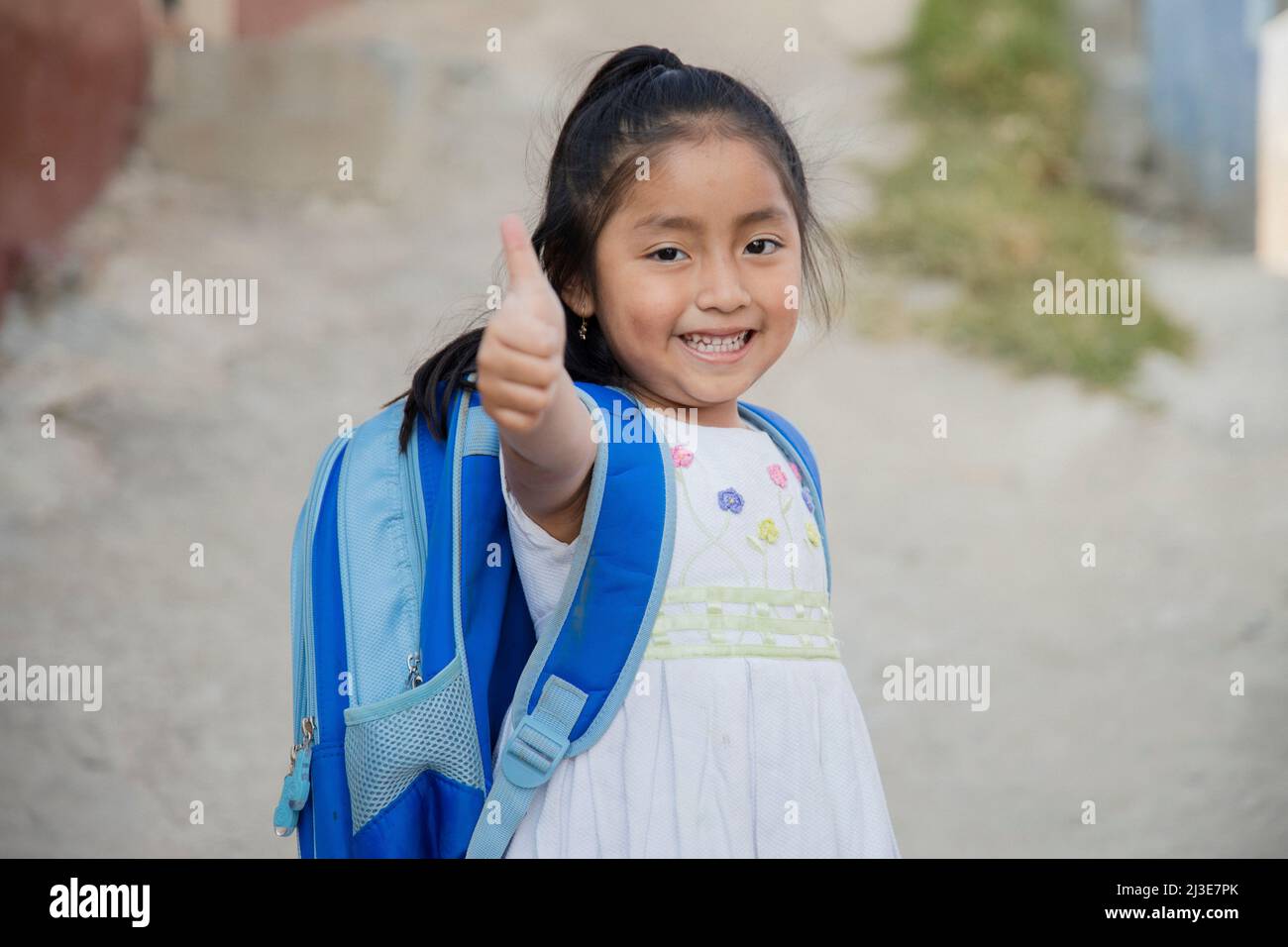 Hispanic girl ready to go to school in rural area - Latin girl on her ...