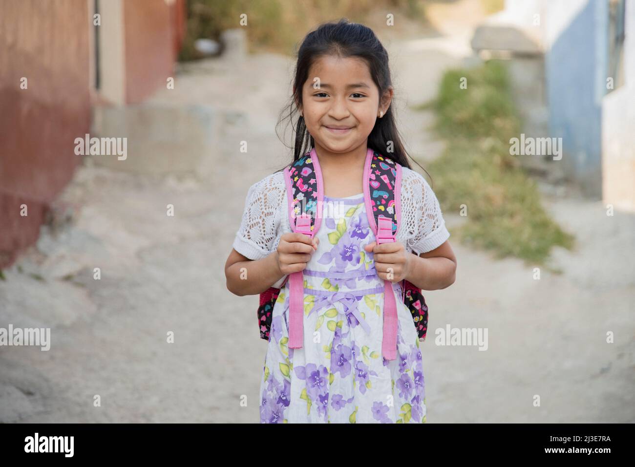 Hispanic girl ready to go to school in rural area - Latin girl on her ...
