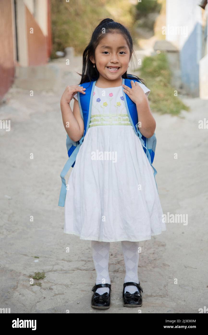 Hispanic girl ready to go to school in rural area - Latin girl on her ...