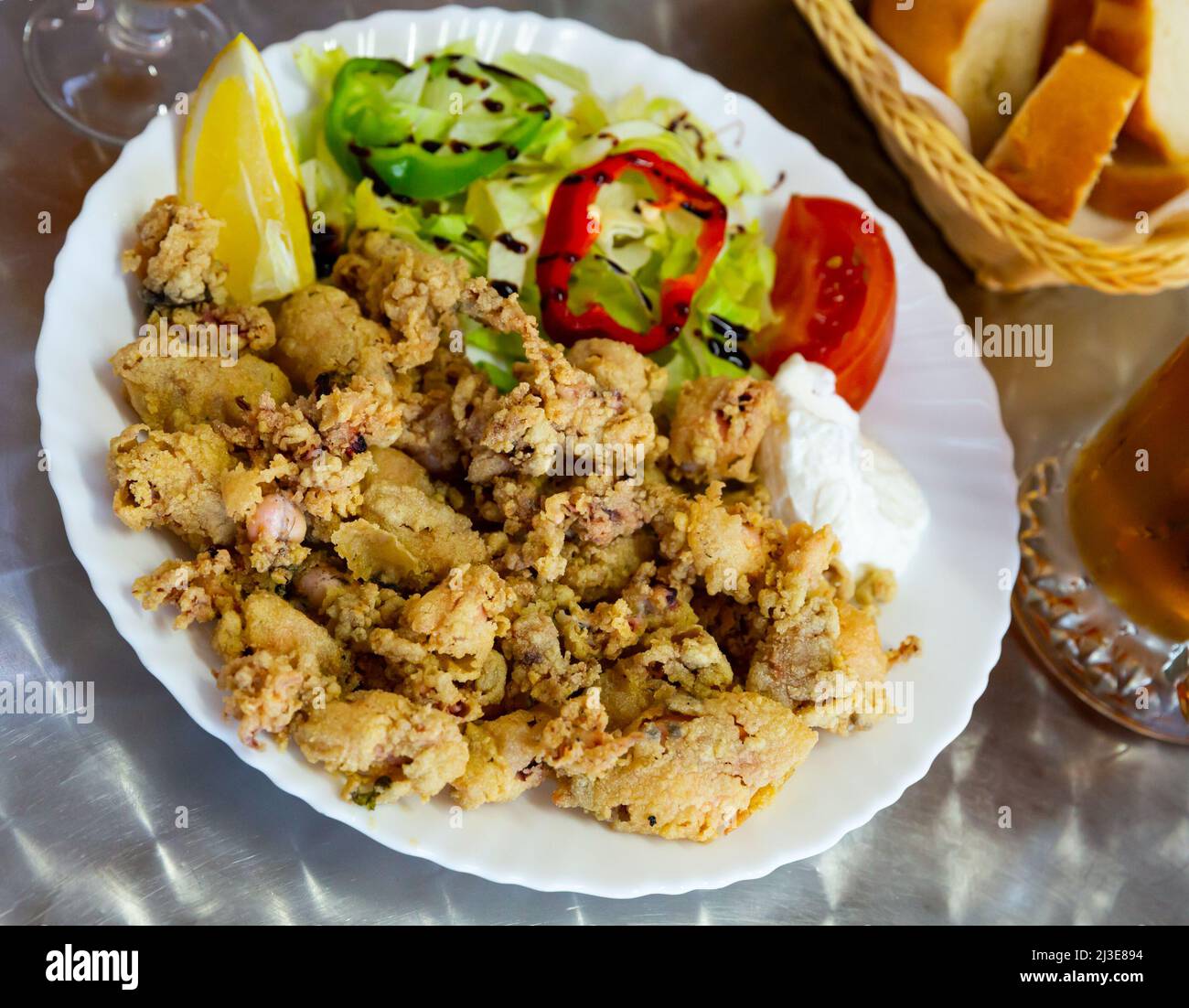 Chipirones battered fried baby squid Stock Photo - Alamy