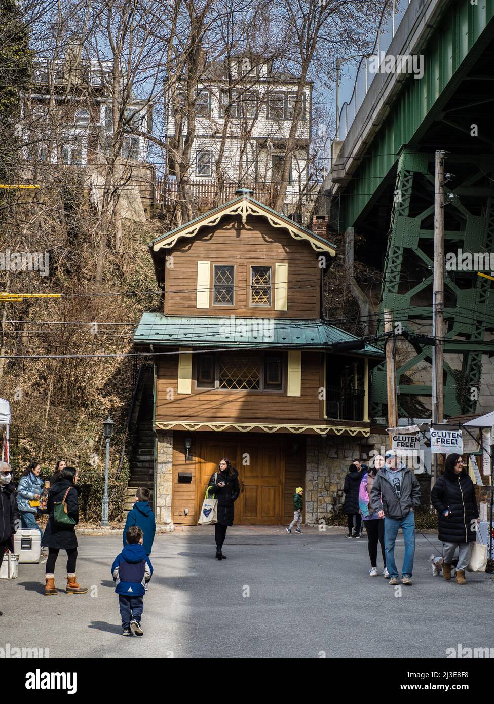 Gingerbread house squeezed under a road overpass bridge Stock Photo - Alamy