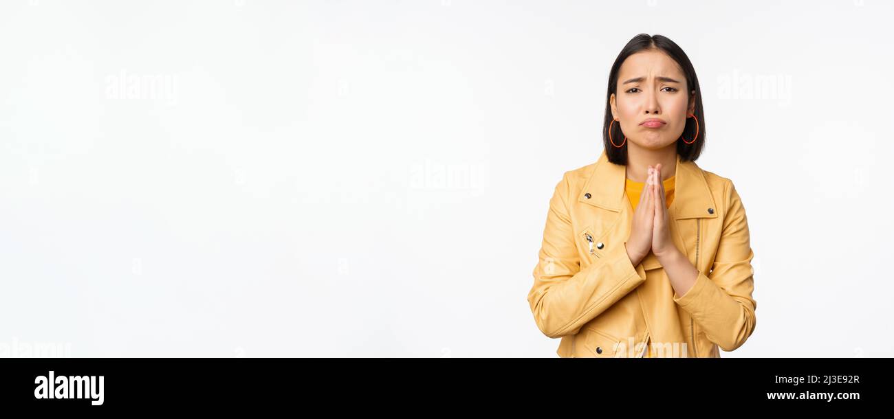 Image of hopeless asian woman begging, pleading, say sorry, looking ...